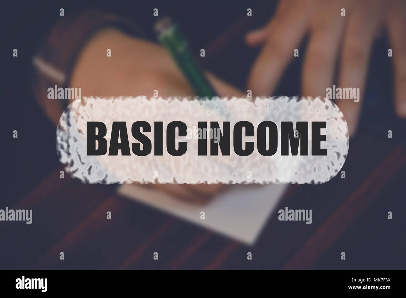 Basic income word with blurring business background Stock Photo - Alamy