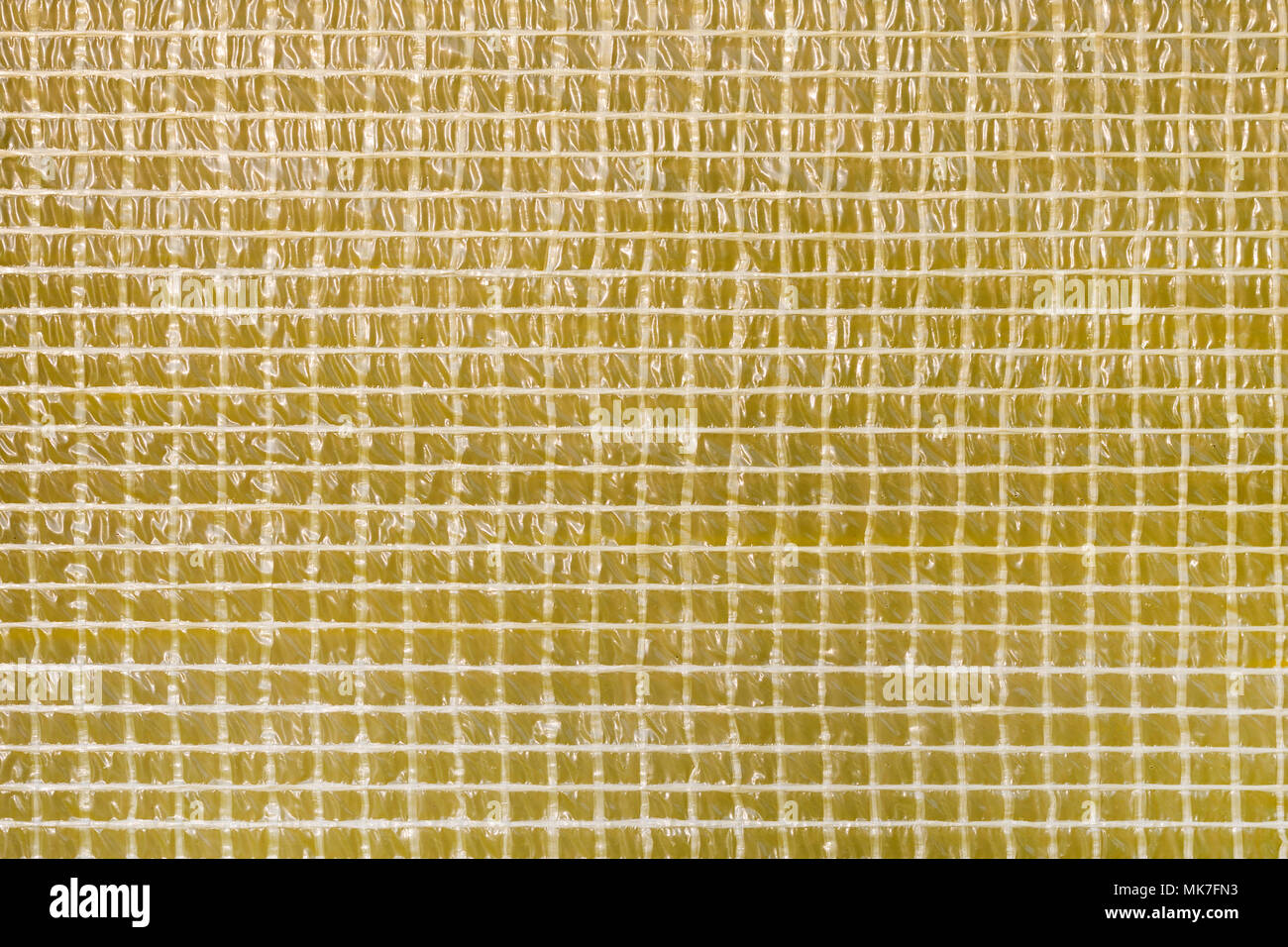 Square geometrical mosaic yellow film texture background. Waterproofing ...