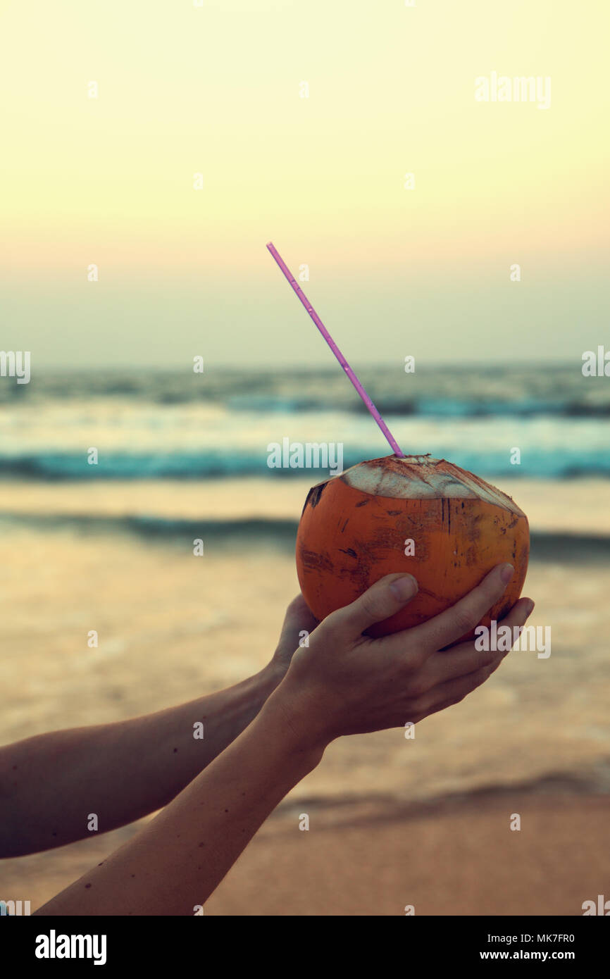 royal coconut in hands Stock Photo - Alamy