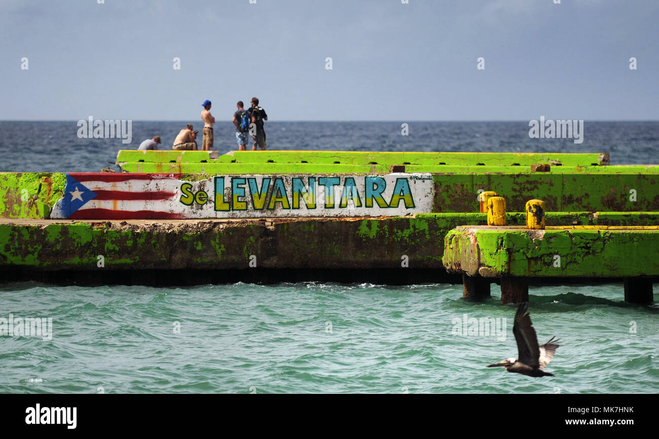AGUADILLA, Puerto Rico – The Puerto Rican flag is painted next to the ...