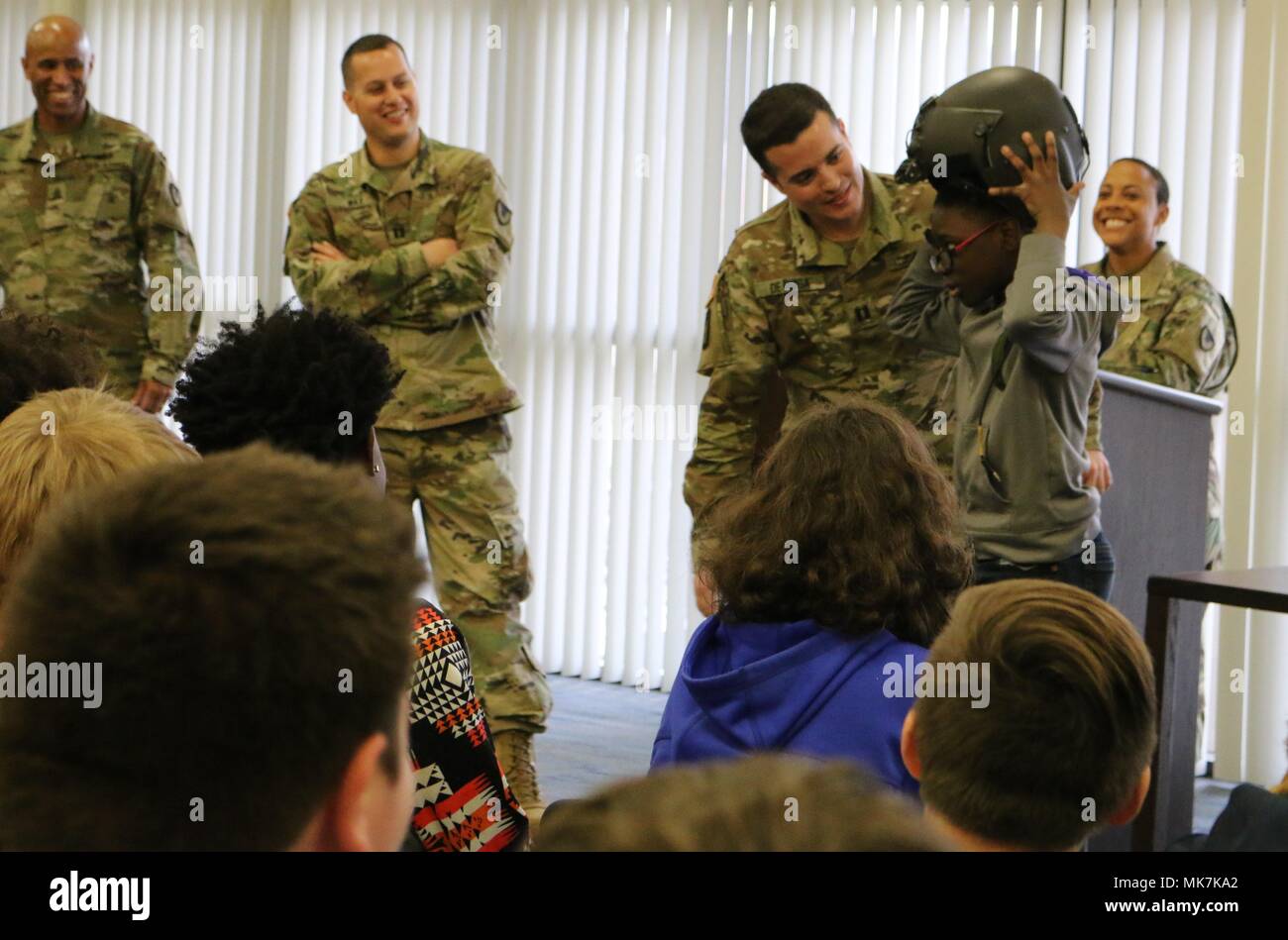 A Buckhorn Middle School student tries on Capt. Alexander De Rosa’s ...