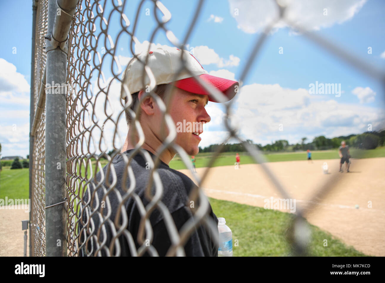 A baseball player photographed through the fence Stock Photo - Alamy