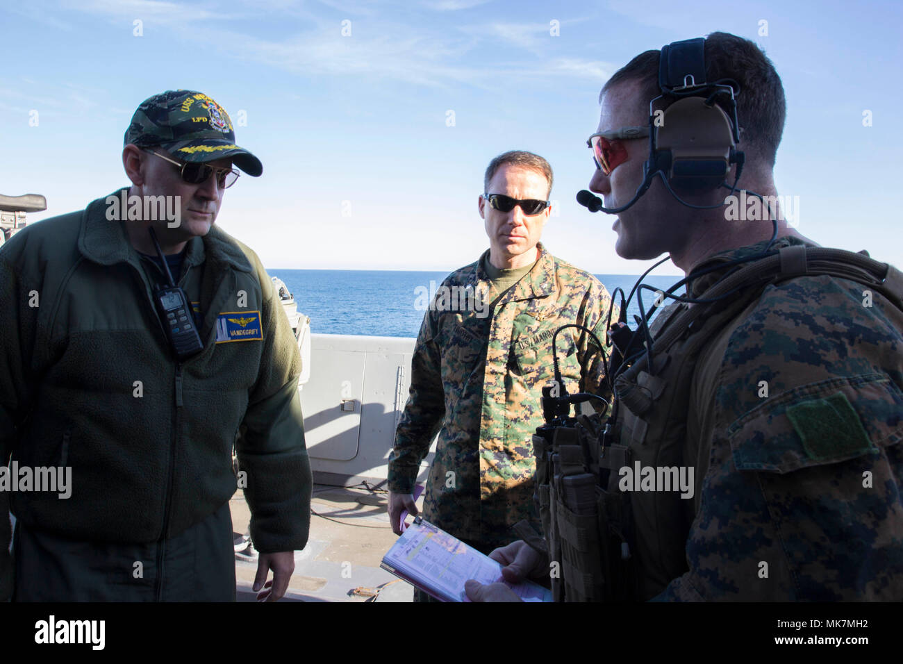 U.S. Navy Capt. Todd Vandegrift, left, captain of the amphibious ...