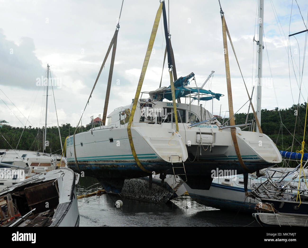The hurricane-displaced sailing vessel, Sea-130, is removed from ...
