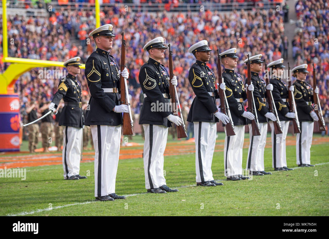Three Clemson University Pershing Rifles present arms as a Fallen ...