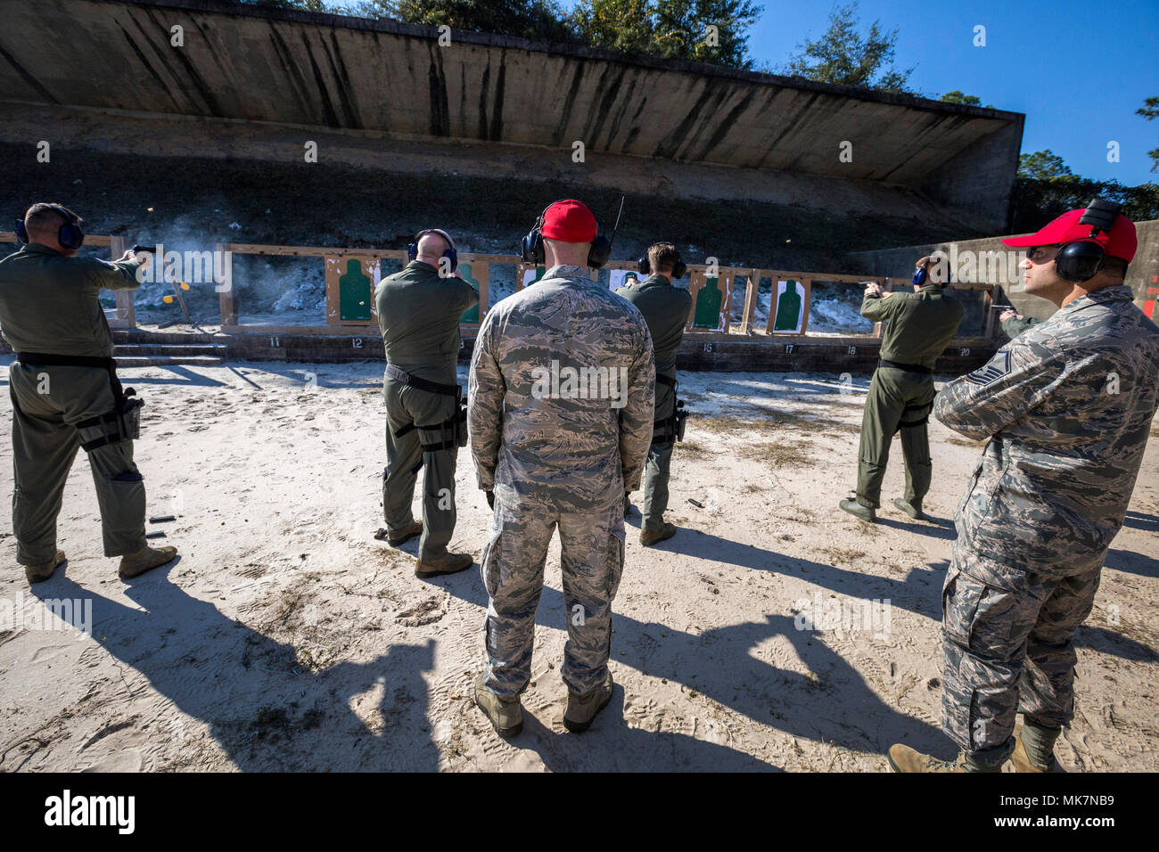 U.S. Air Force Staff Sgt. Michael Chiarella, third from left, and ...