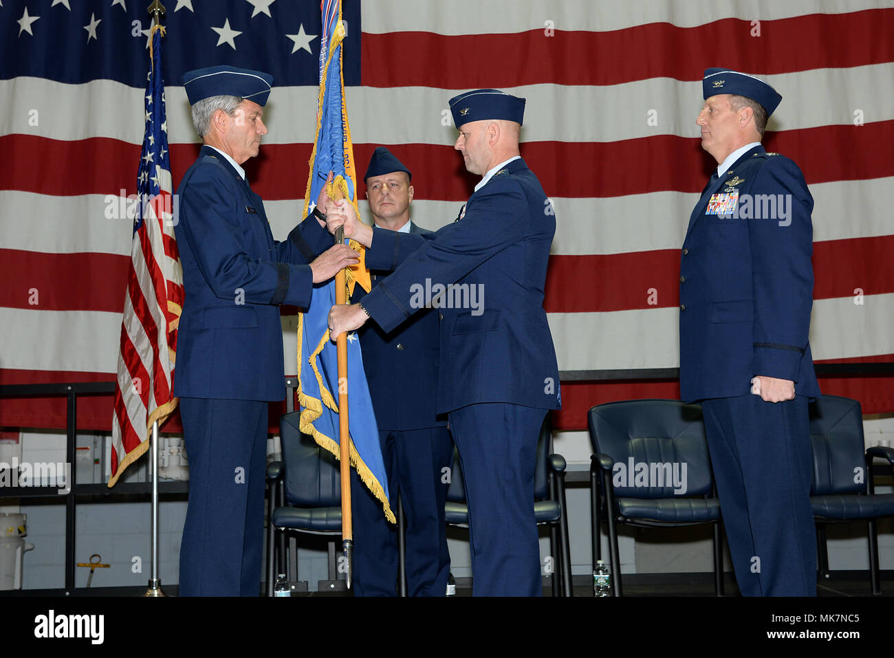U.S. Air Force Col. John R. DiDonna, Jr., outgoing 177th Fighter Wing commander, passes the ...