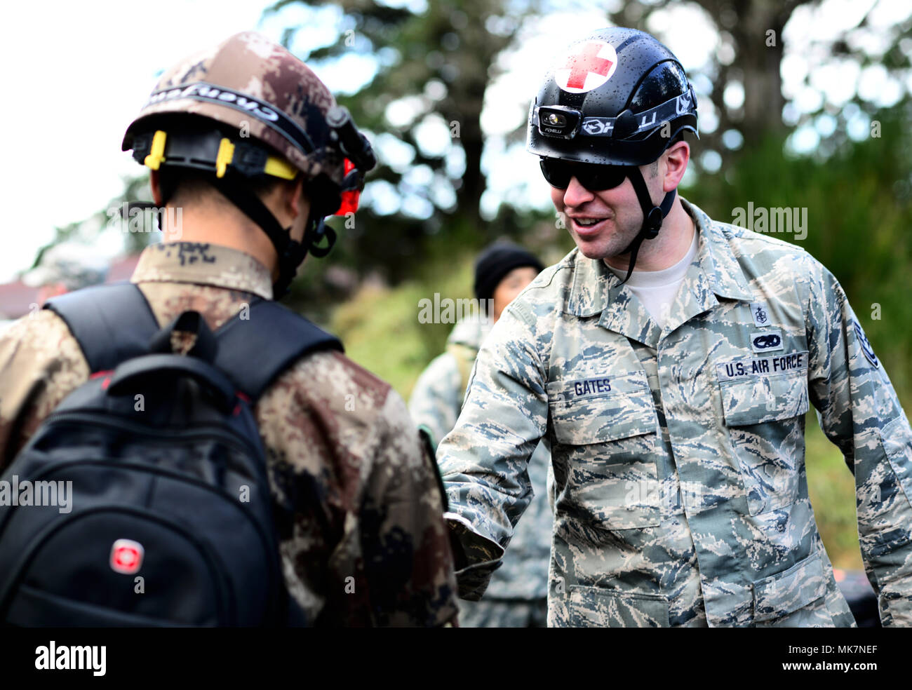 Oregon Air National Guard Master Sgt. Daniel Gates (left), with ...