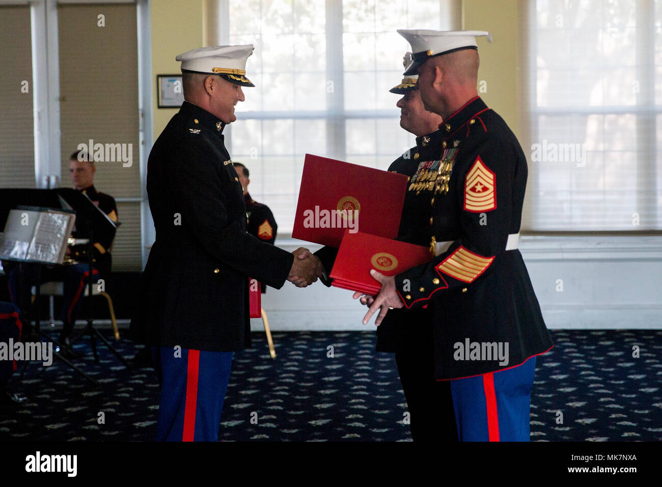 U.S. Marine Corps Col. Gary F. Keim, left, receives an award during his ...