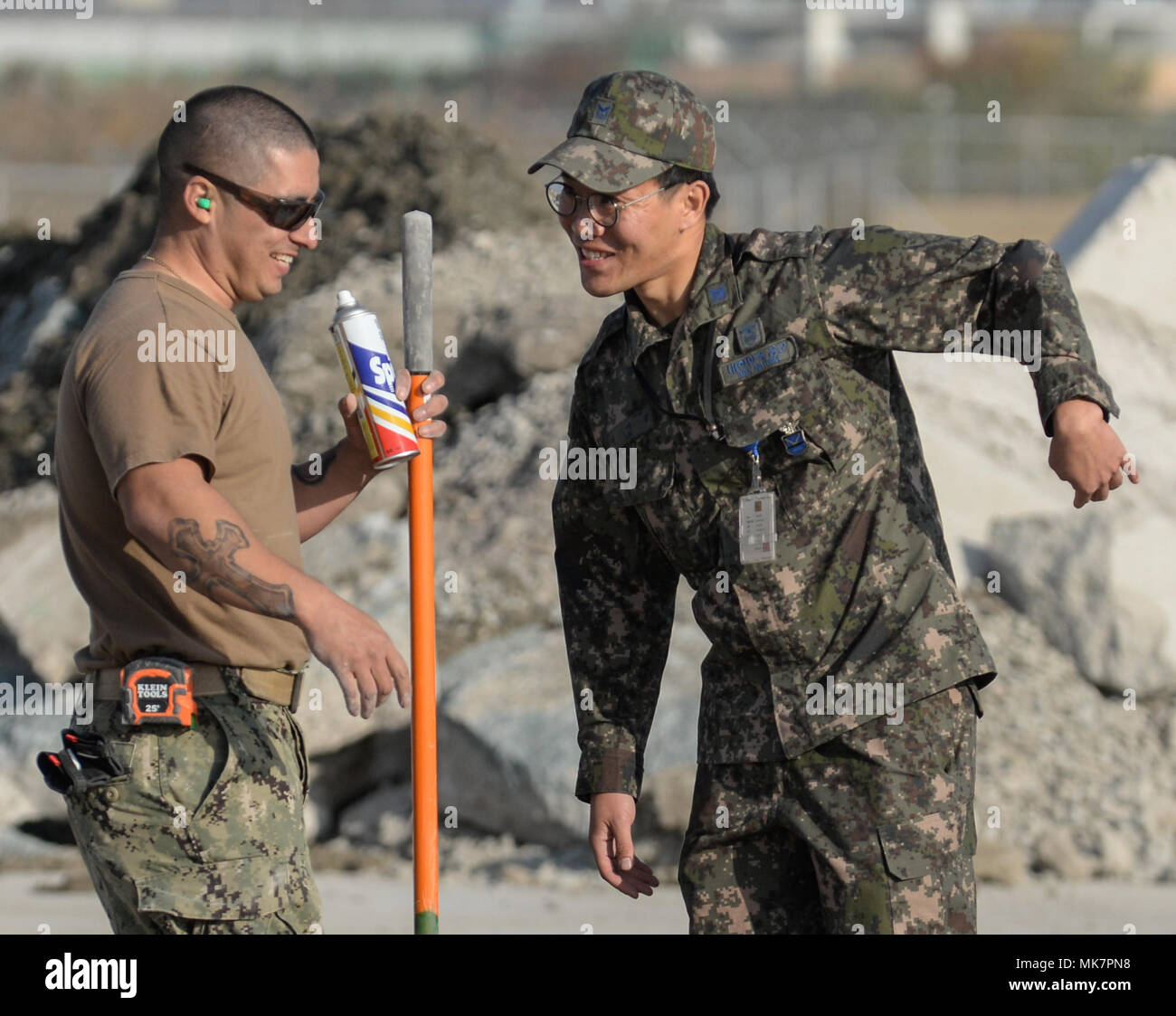A U.S. Navy Seaman and a Republic of Korea Air Force Airman interact ...