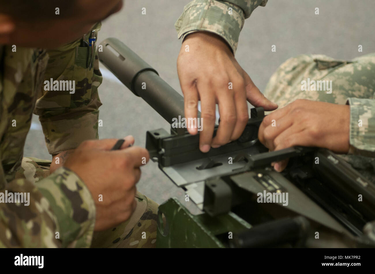 U.S. Army Reserve Soldiers conduct primary marksmanship instruction on a Mark 19 40 mm grenade ...
