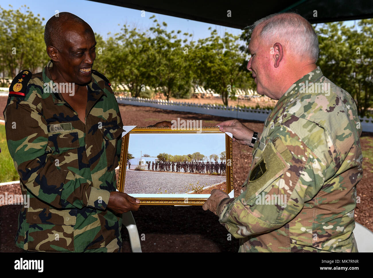 Djibouti Armed Forces (FAD) Lt. Col. A. Omar (left) presents a gift to ...