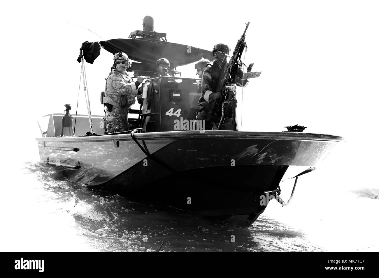 An African team comes ashore after operating a group of Special ...