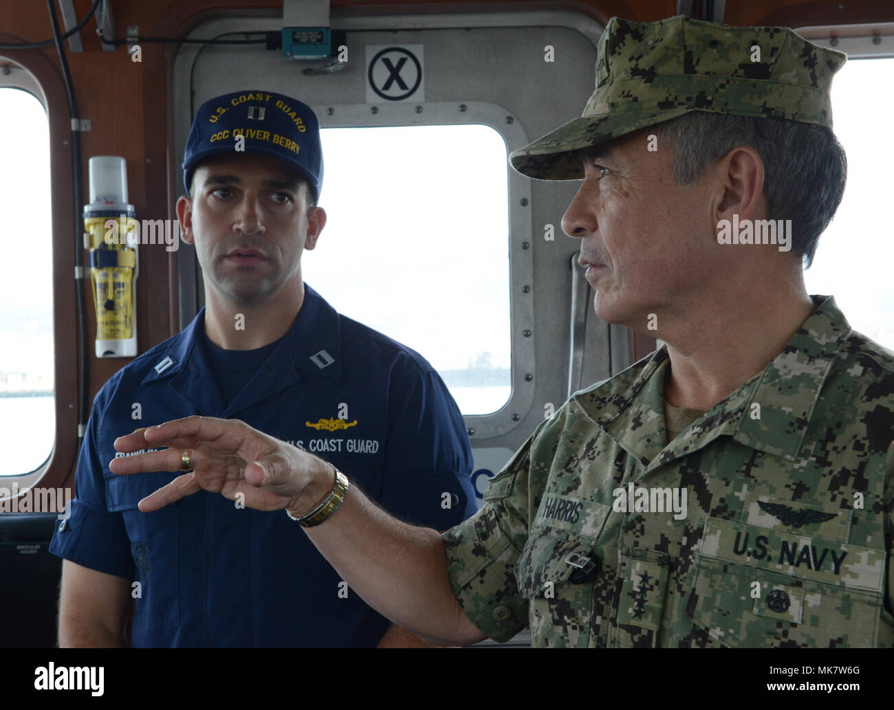 Adm. Harry Harris, Jr., Commander, U.S. Pacific Command, speaks with Lt ...