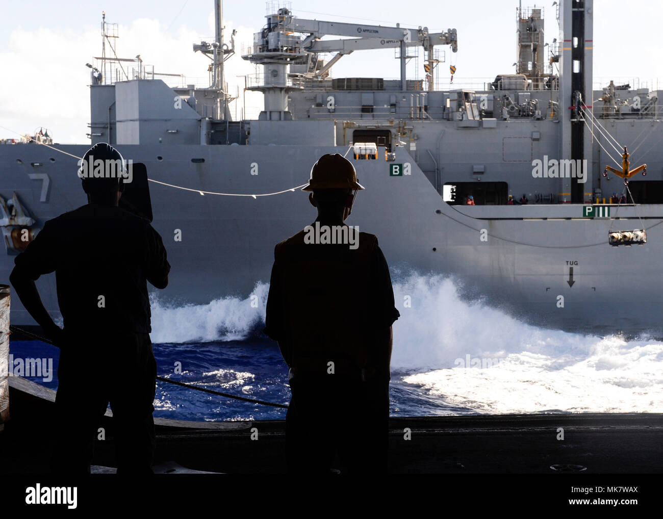 PACIFIC OCEAN (Nov. 21, 2017) U.S. Navy Sailors observe ordnance being ...