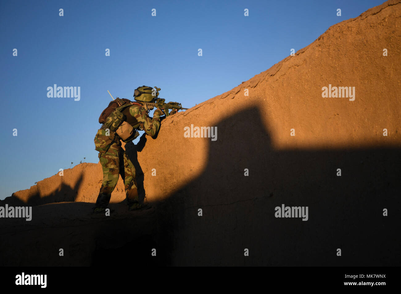 An Afghan special operator scans his sector during offensive operations ...