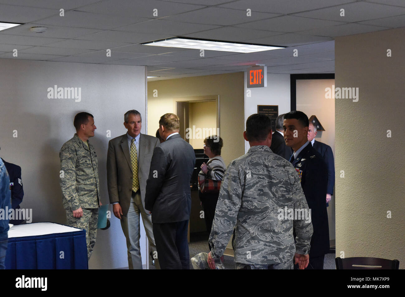 Guests socialize after the ribbon cutting of the International ...