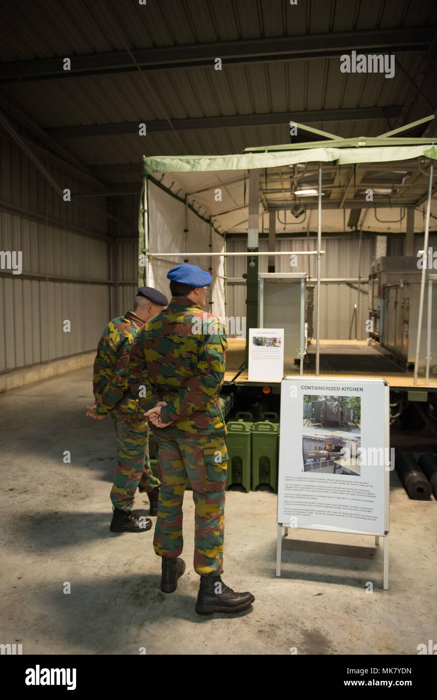 Soldiers with the Belgian Armed forces look at the containerized ...