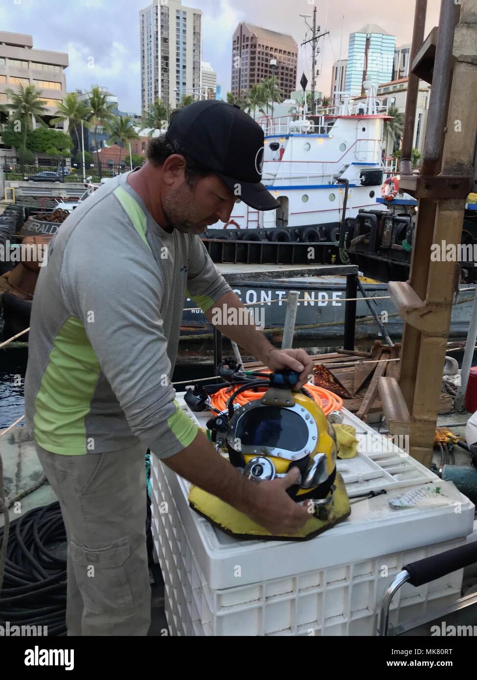 Salvors prepare gear at their facility in Honolulu, Hawaii, ahead of ...