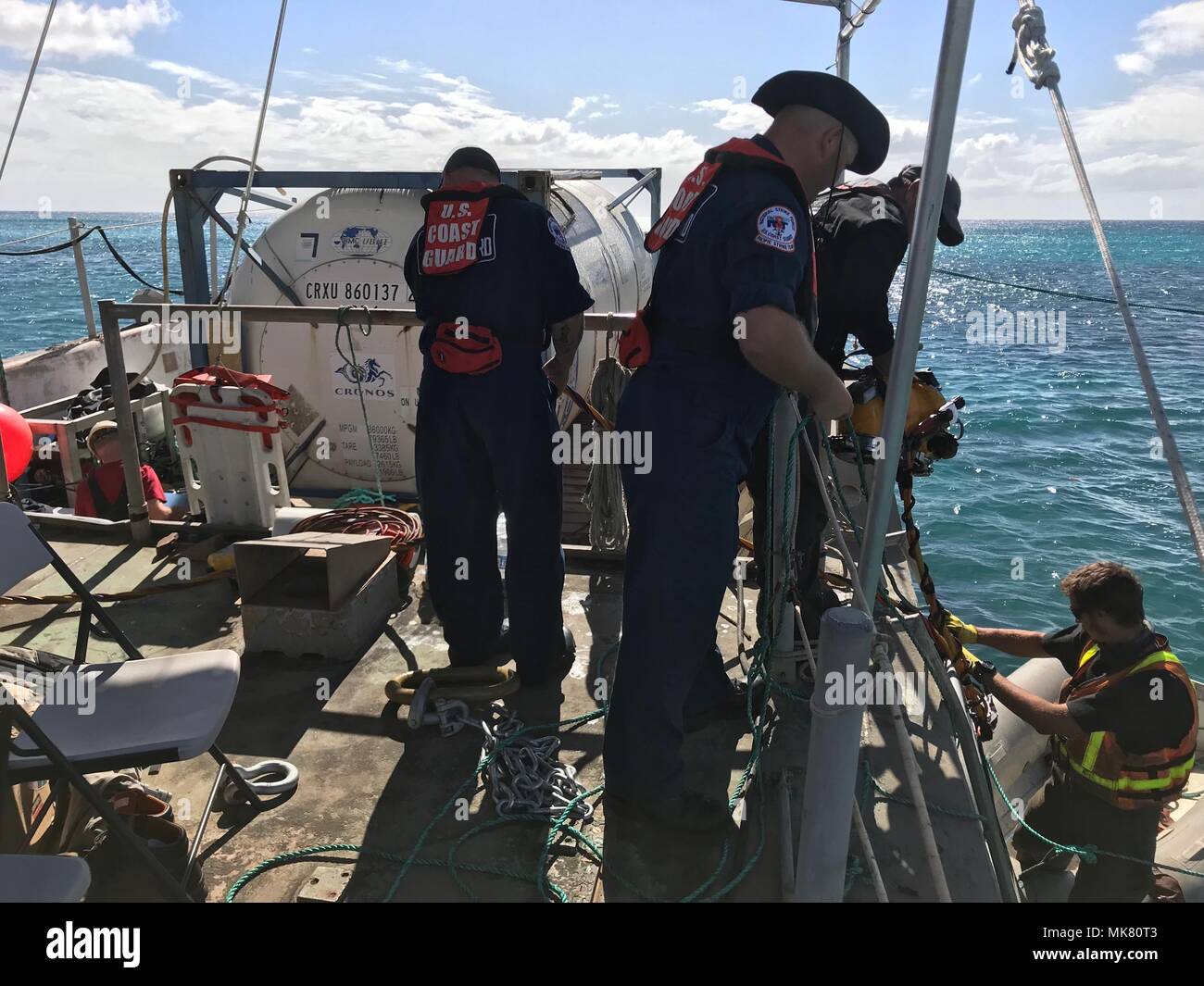 Members of the Coast Guard Pacific Strike Team provide safety oversight ...