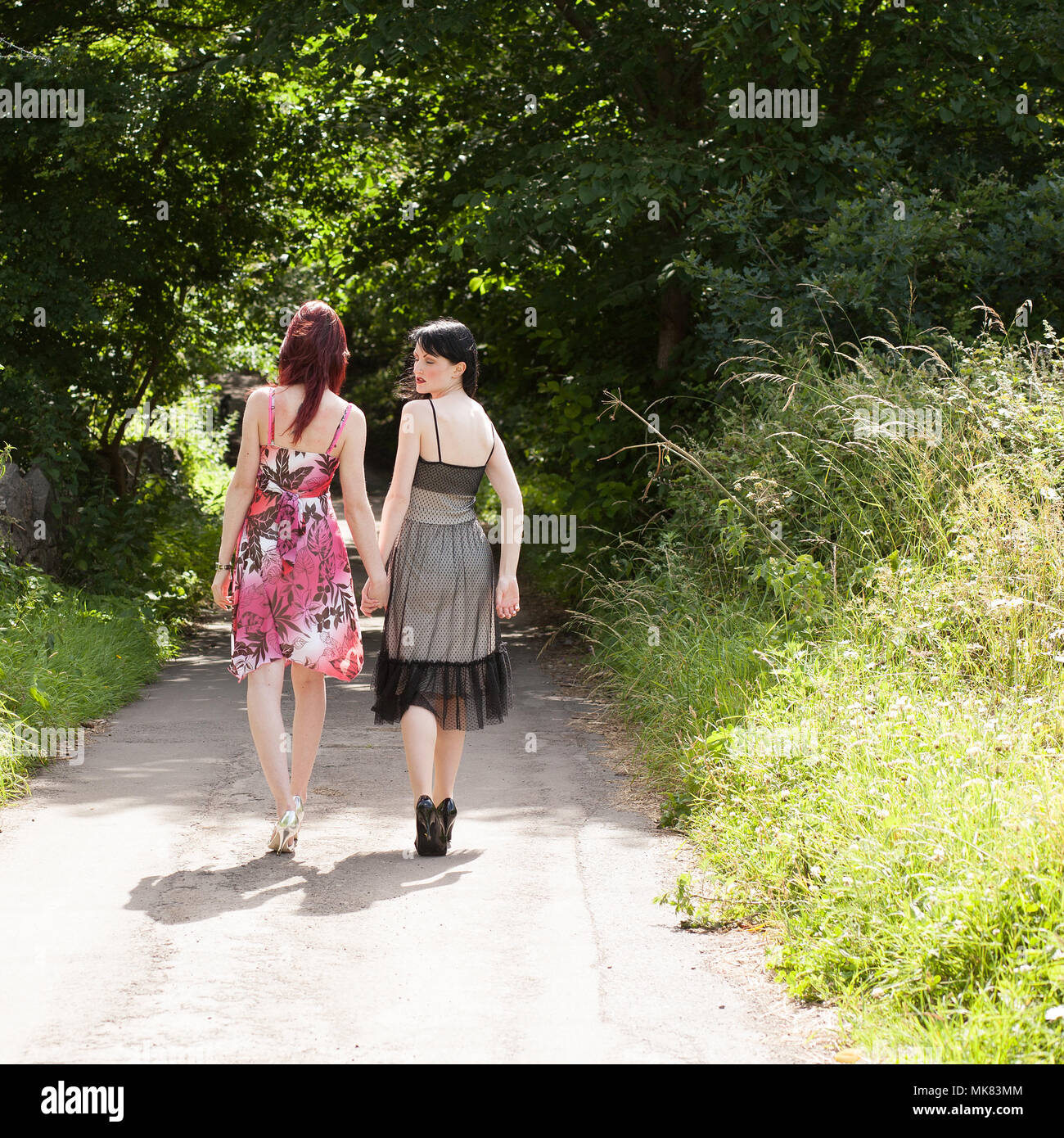 Two girls models walking hi-res stock photography and images - Alamy