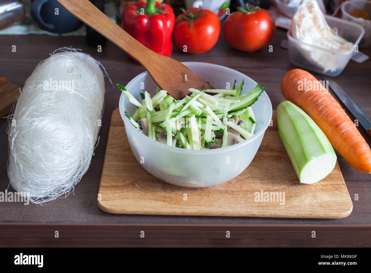 mise en place setup of ingredients for dinner on wooden cutting board ...