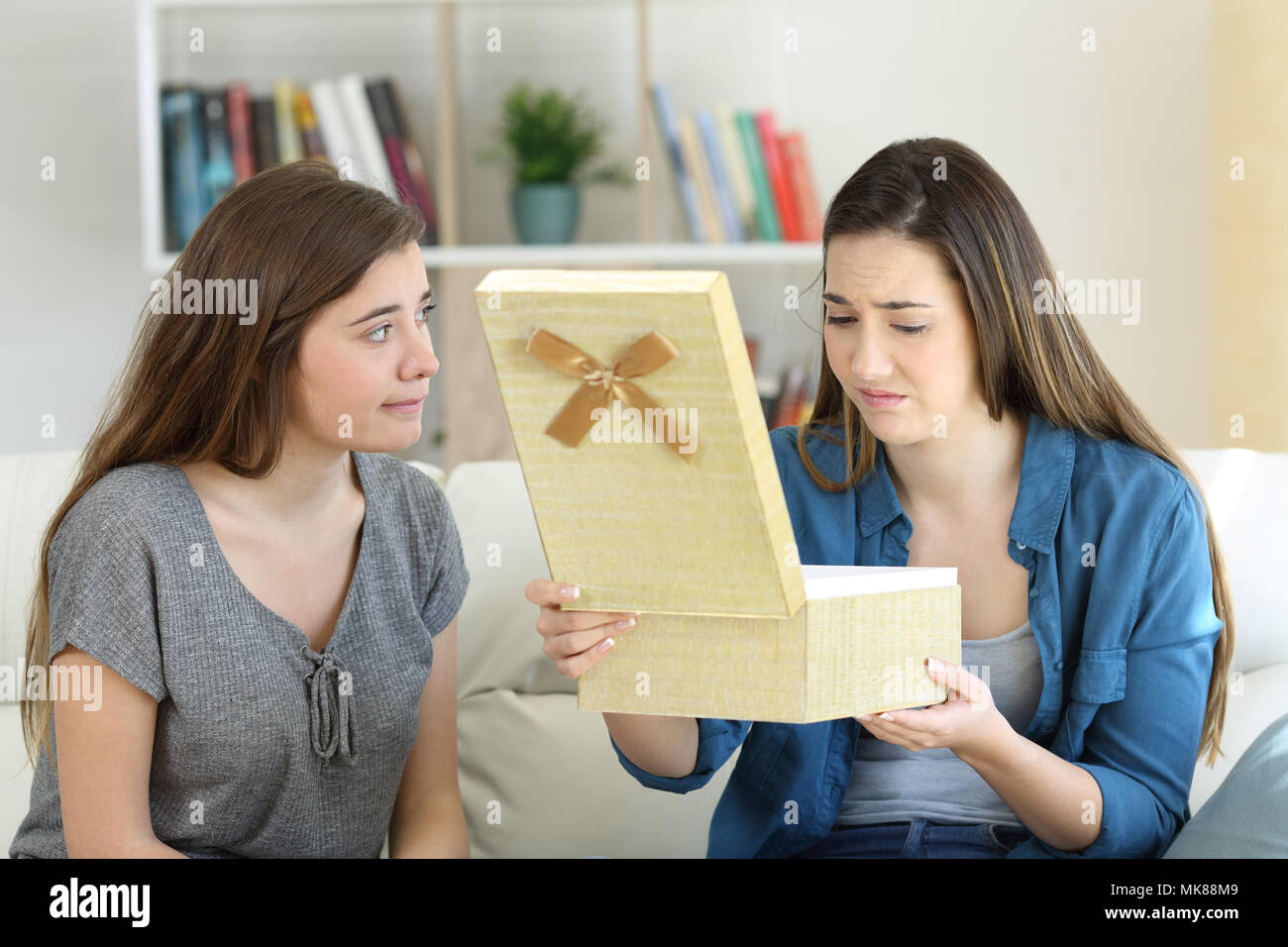 Sad teenager gift box hi-res stock photography and images - Alamy