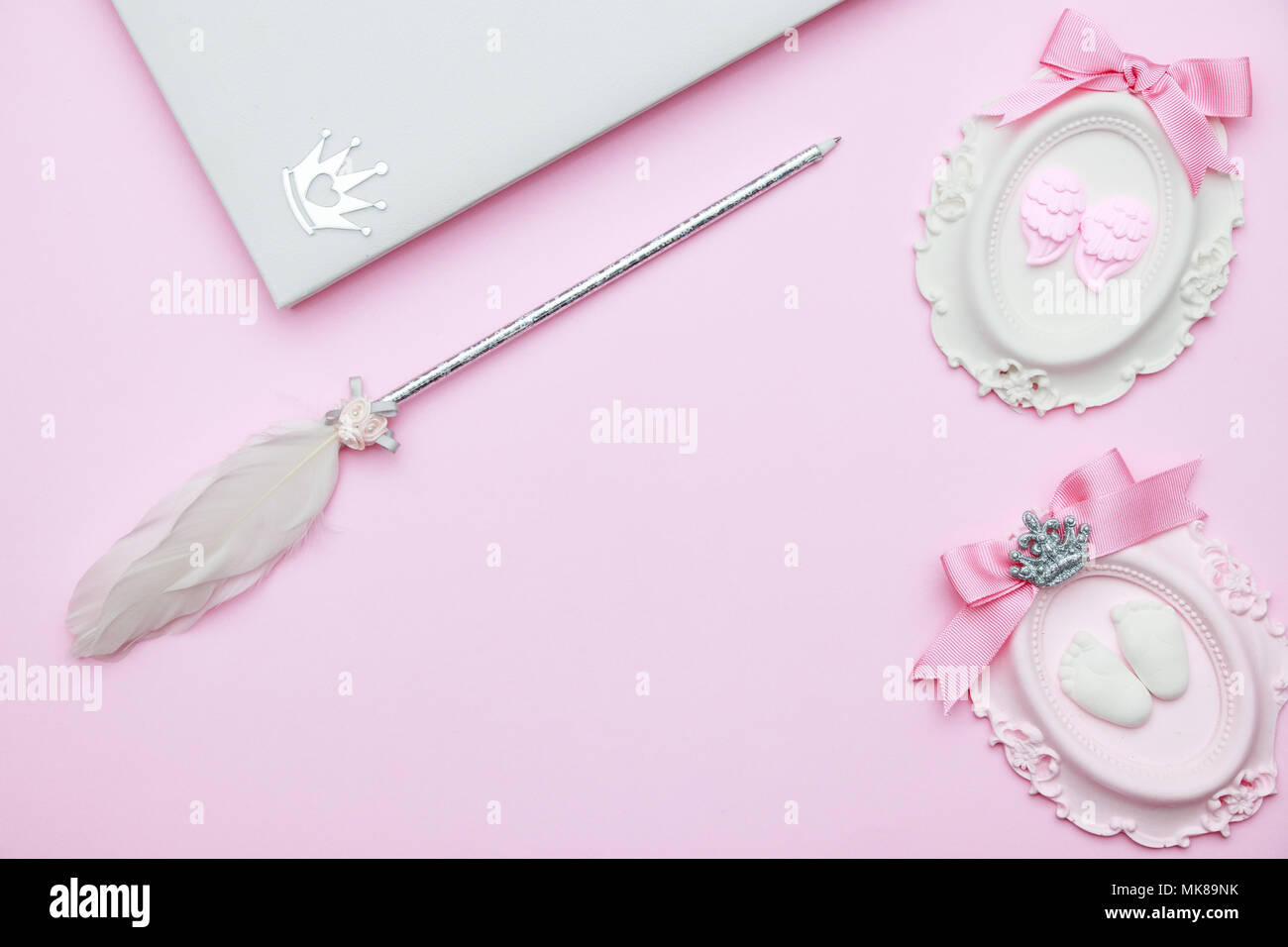 Beautiful pastel pink layout with stone decoration, notepad, bird hair ...