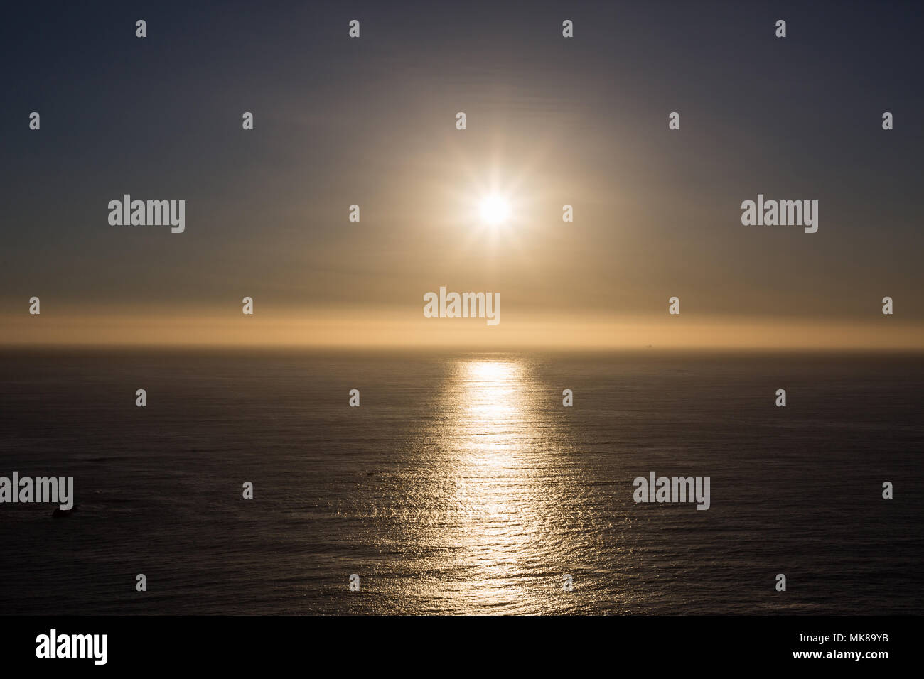 Golden sunset over the sea with reflection Stock Photo - Alamy
