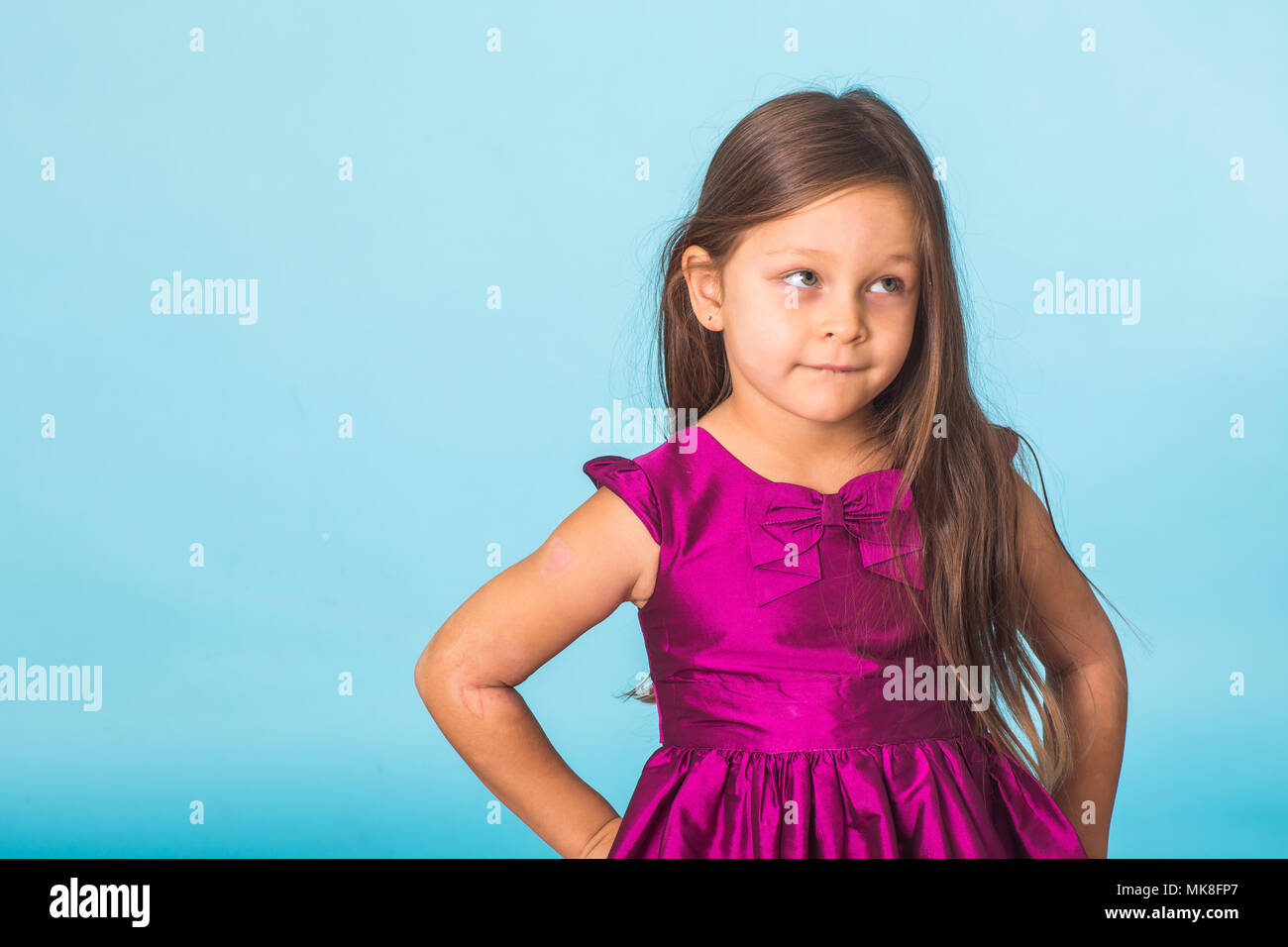 Sweet little girl over blue background Stock Photo - Alamy
