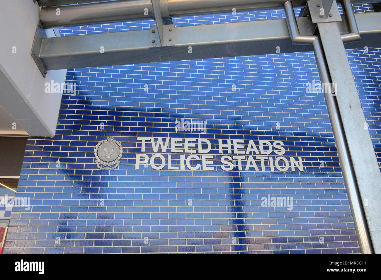 front of new Tweed Heads Police Station including sign on tiled wall ...