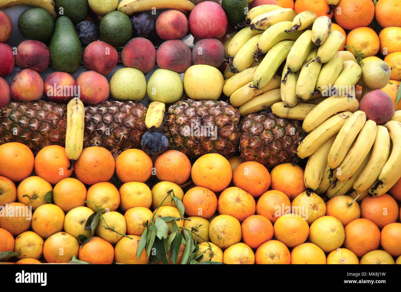 Different ripe fruits in supermarket. Oranges, bananas, pineapples ... Different ripe fruits in supermarket. Oranges, bananas, pineapples ...