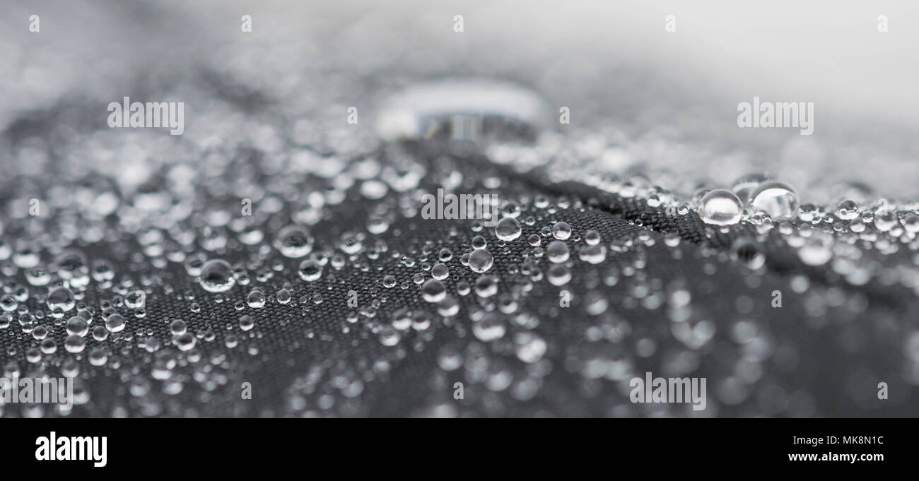 Closeup detailed view of raindrops on a fabric, a background Stock ...