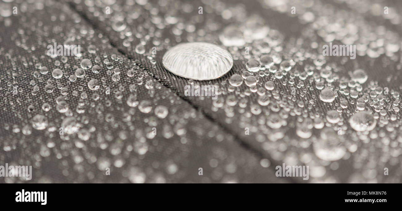 Closeup detailed view of raindrops on a fabric, a background Stock ...