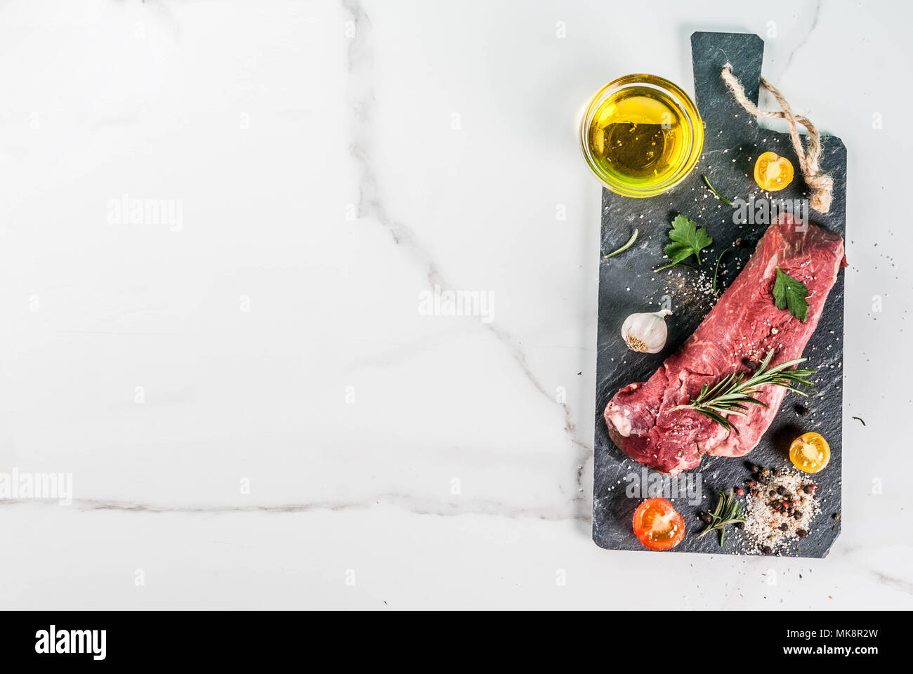 Raw beef meat with spices top view copy space Stock Photo - Alamy