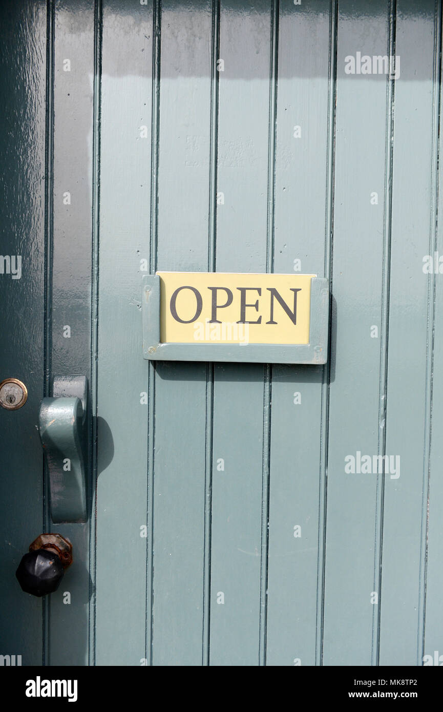 Wooden hand painted open sign on eggshell wooden door Stock Photo - Alamy