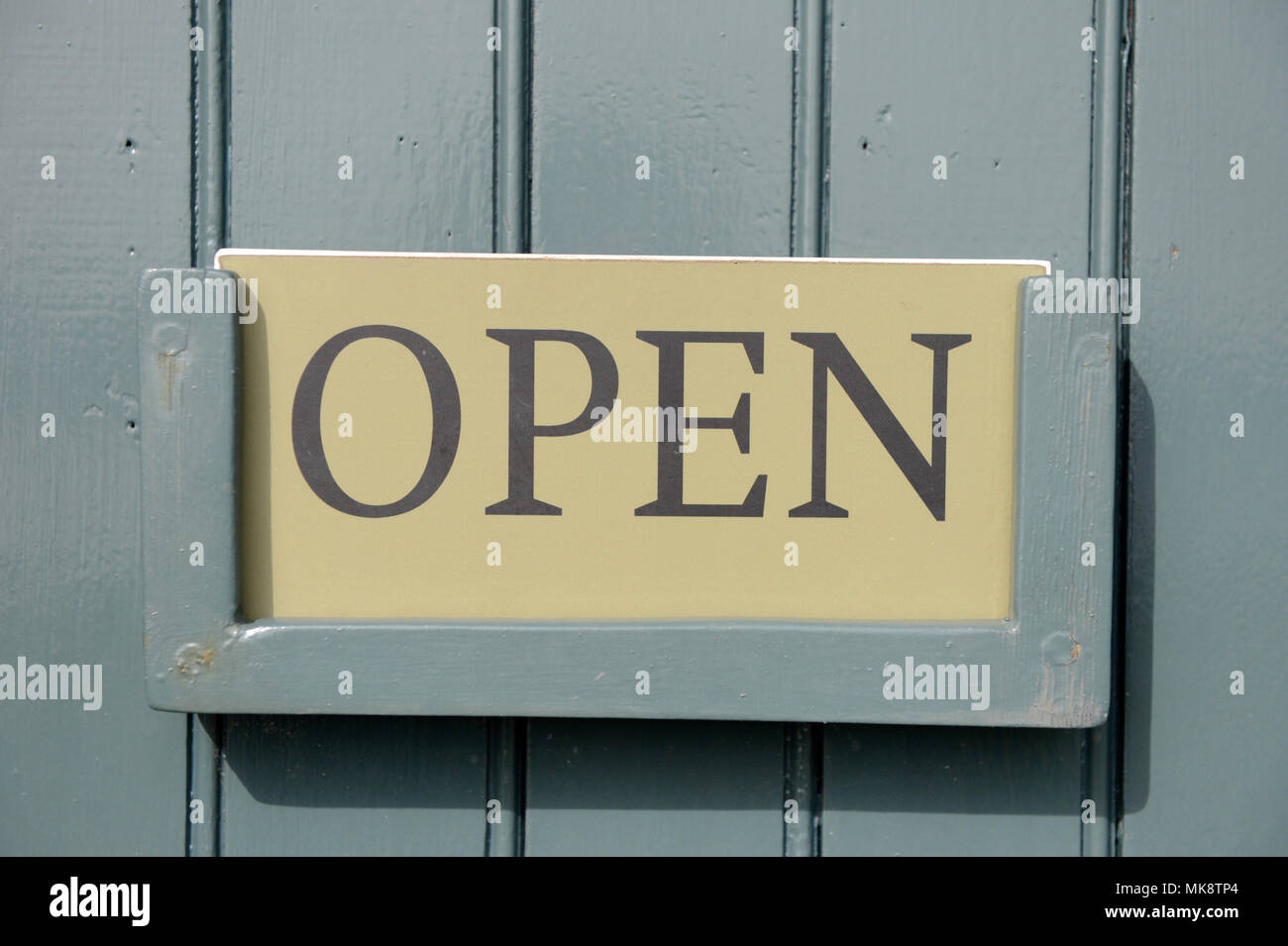 Wooden hand painted open sign on eggshell wooden door Stock Photo - Alamy