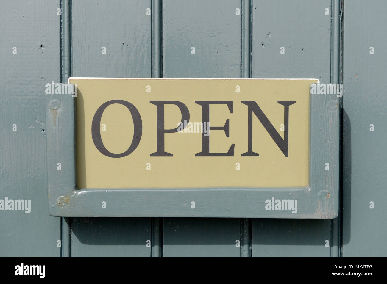 Wooden hand painted open sign on eggshell wooden door Stock Photo - Alamy