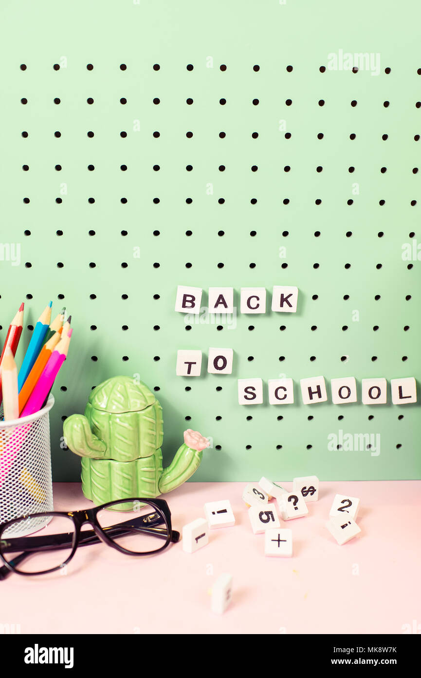 Back to school supplies pastel workspace with pencils, glasses, cacti ...