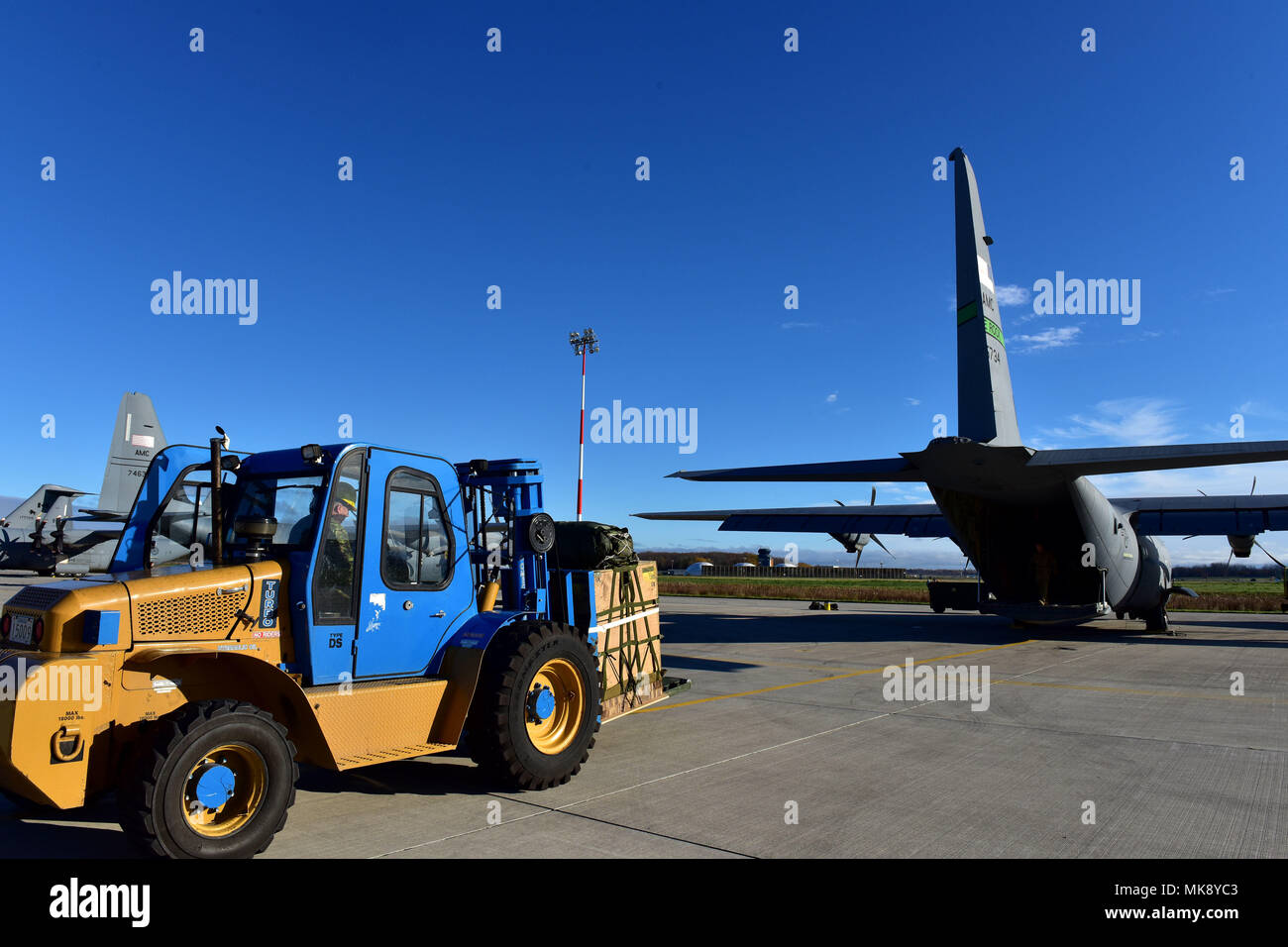 Royal Canadian Air Force traffic technicians load Container Delivery ...