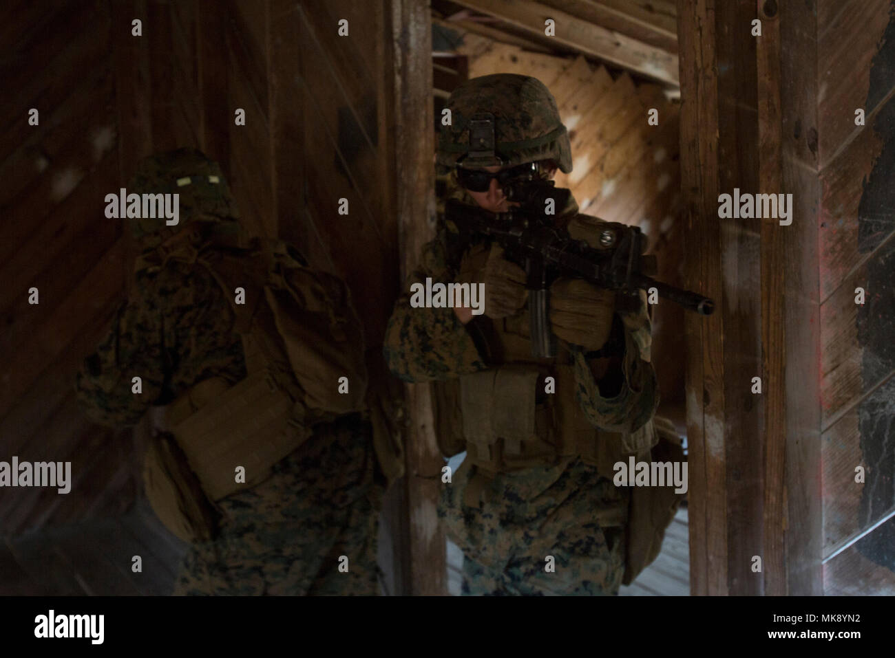 Marines with 1st Battalion, 2nd Marine Regiment clear a room during a ...