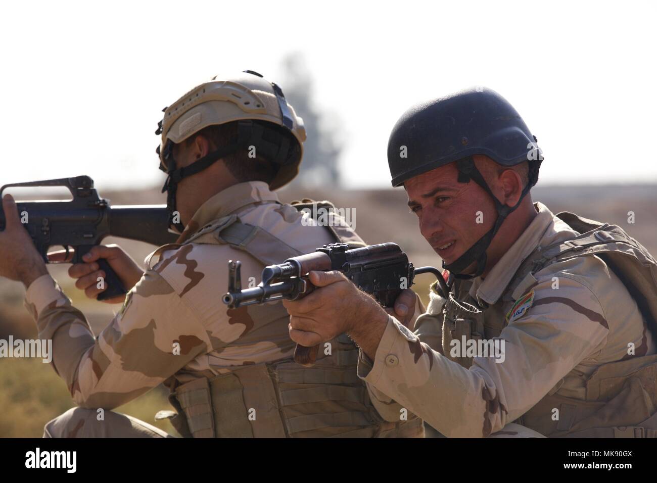 Members of the Iraqi Security Forces provide security during rural ...