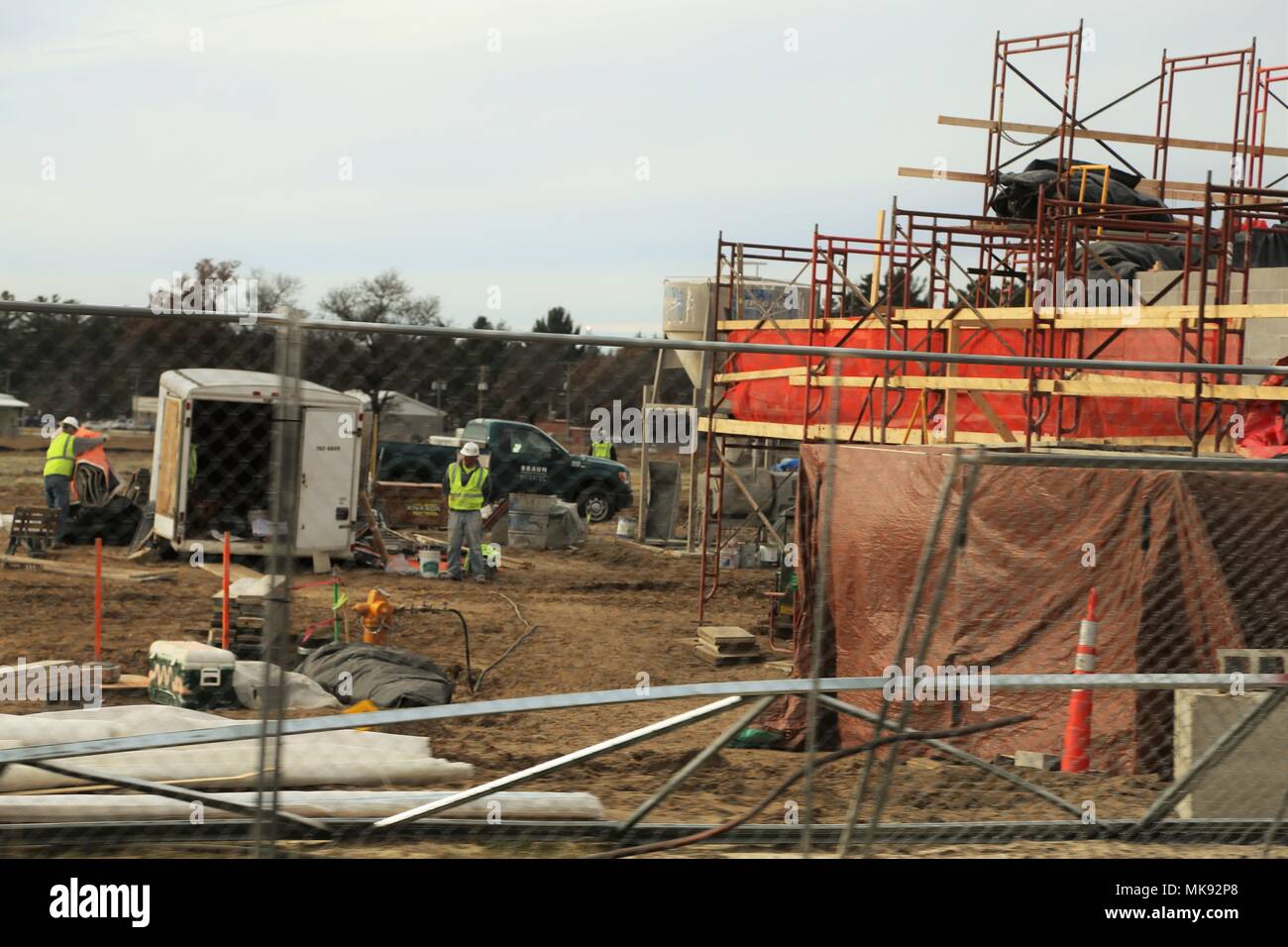 Workers with Catamount Constructors, Inc. of Lakewood, Colo., continue construction of the Fort ...