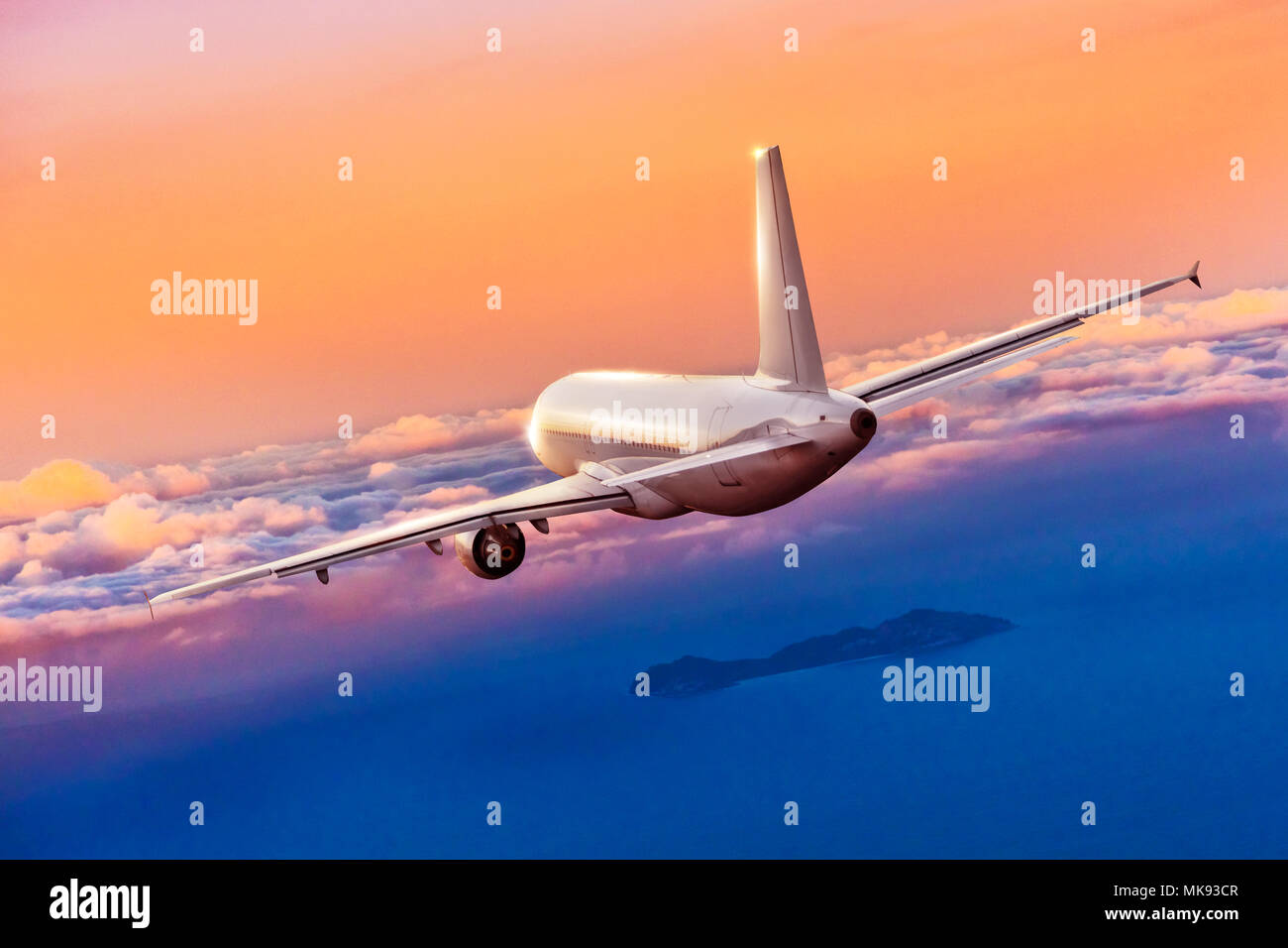 Passengers commercial airplane flying above clouds, back view. Concept ...