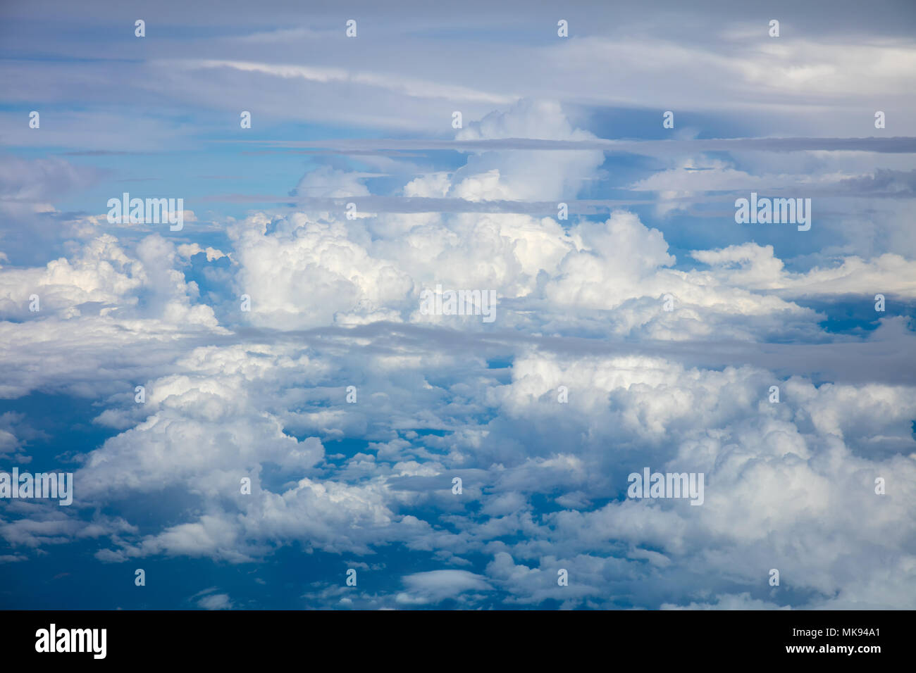 Amazing clouds and sky atmosphere viewed from the plane. High ...