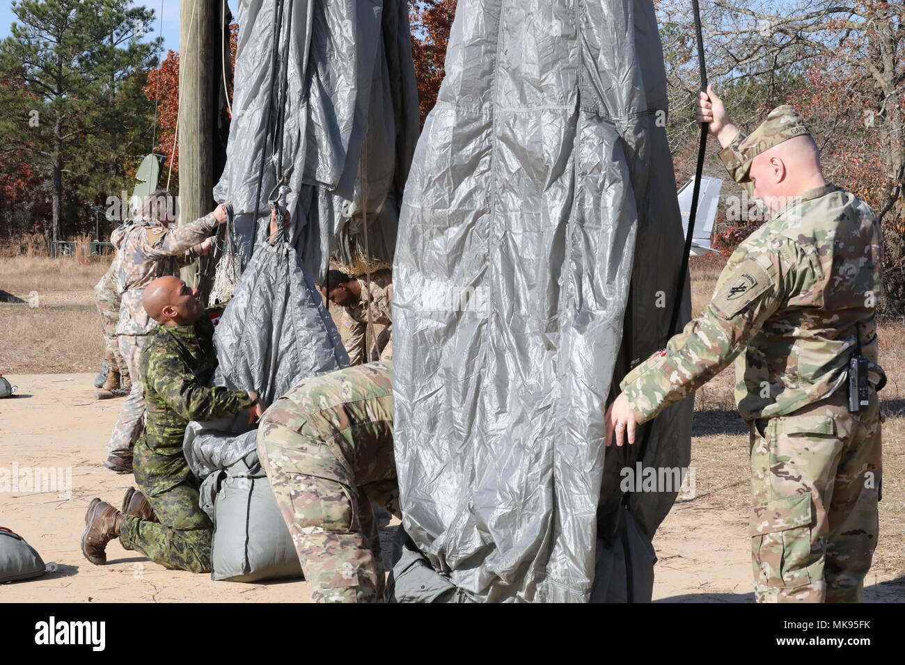 U.S. Army and foreign Jumpmasters conducts chute shake out after ...