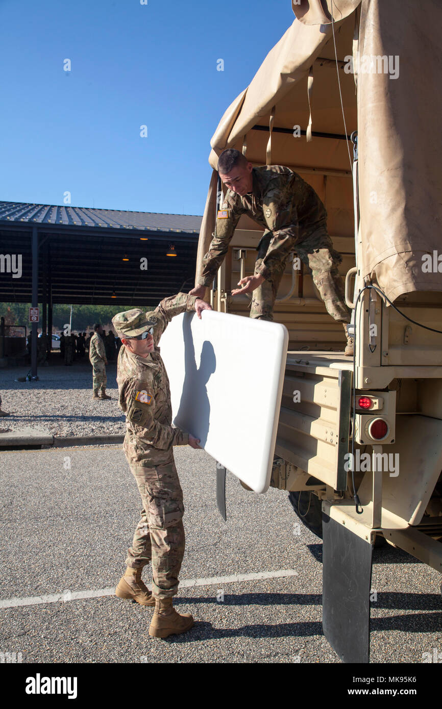 Sgt. Seth Coil of the 706th Transportation Company, and Spc. Michael ...