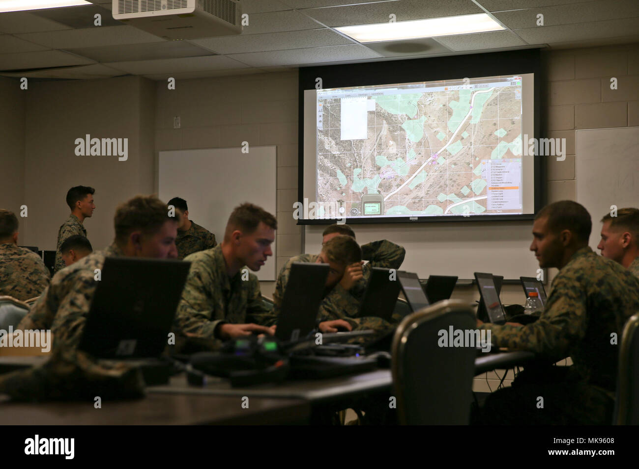 U.S. Marines attending the Infantry Unit Leaders Course study the ...