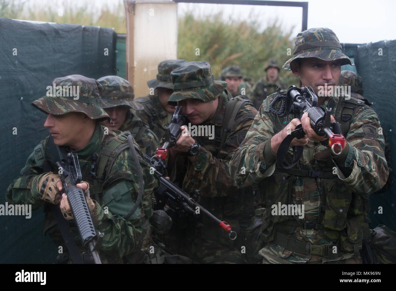 Greek Marines clear a building during a heliborne raid at Maleme ...