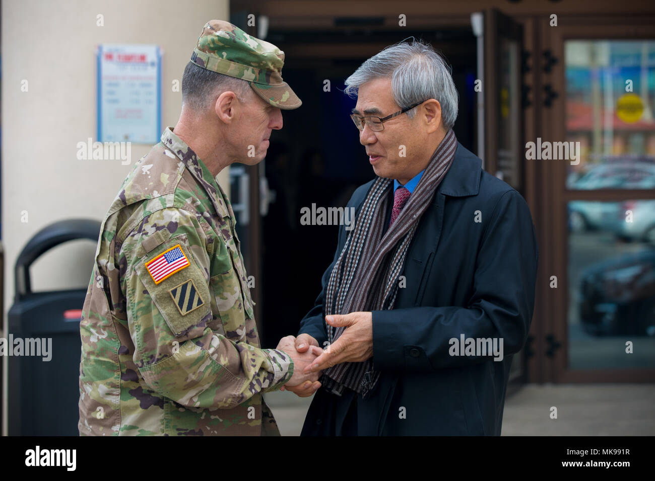 U.S. Army Lt. Gen. Thomas Vandal, 8th Army commanding general, shakes ...